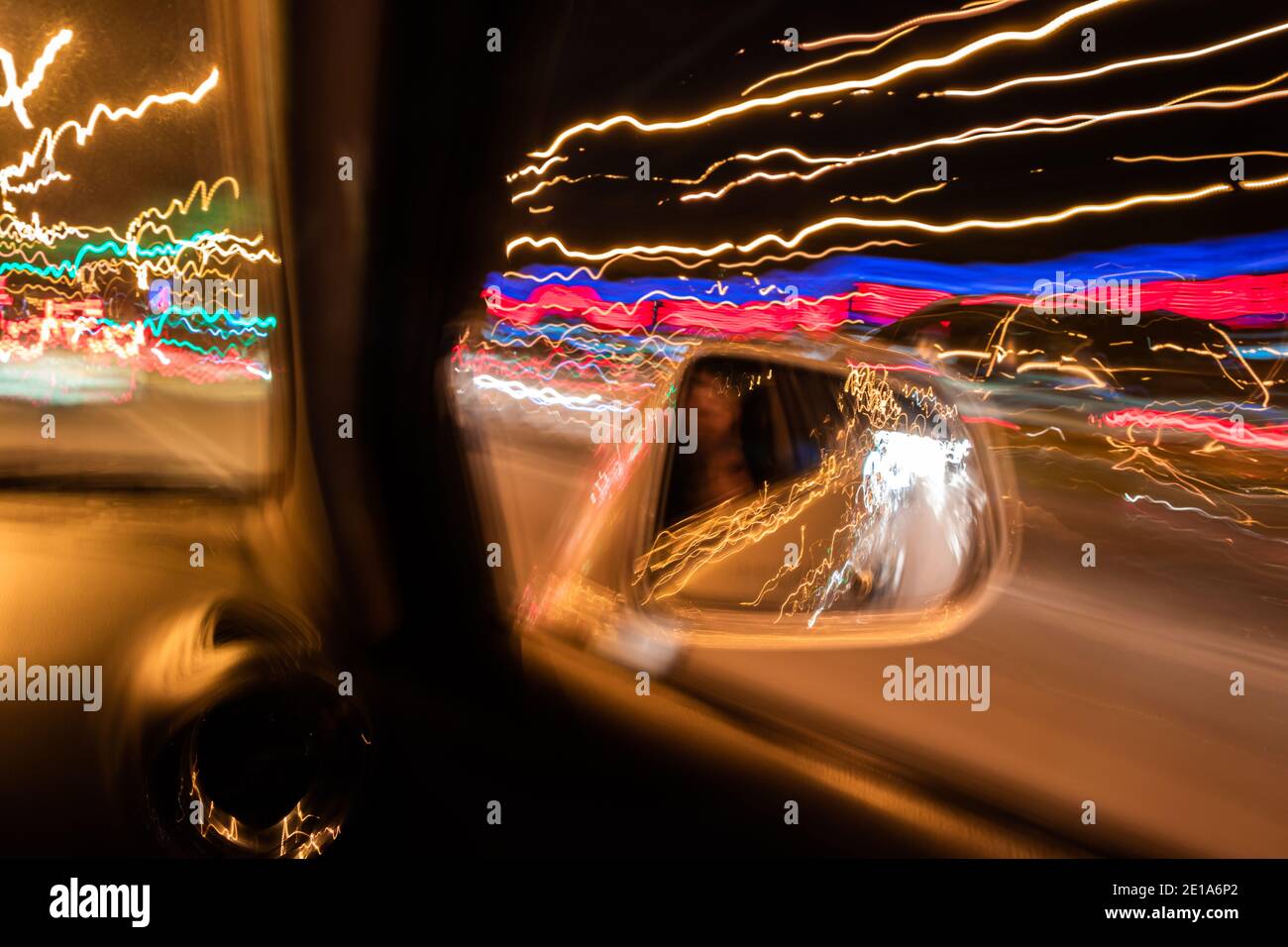 Light streaks drawn due to the movement at a great speed on the road by ...