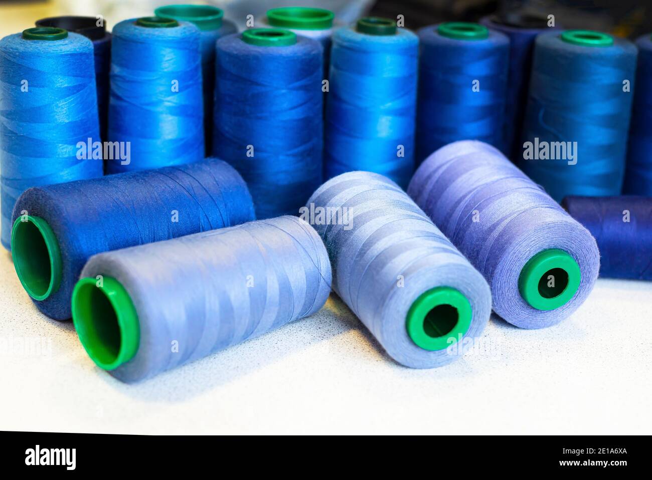 Babies of blue threads of different tones and shades. Copy space for ...