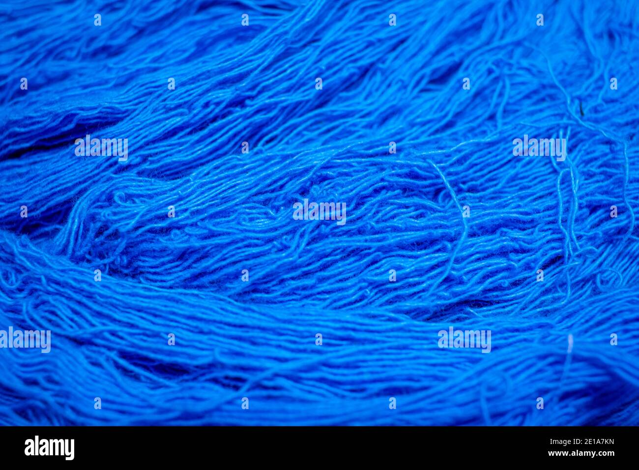 Close view of the blue color thread yarns used in textile industry ...