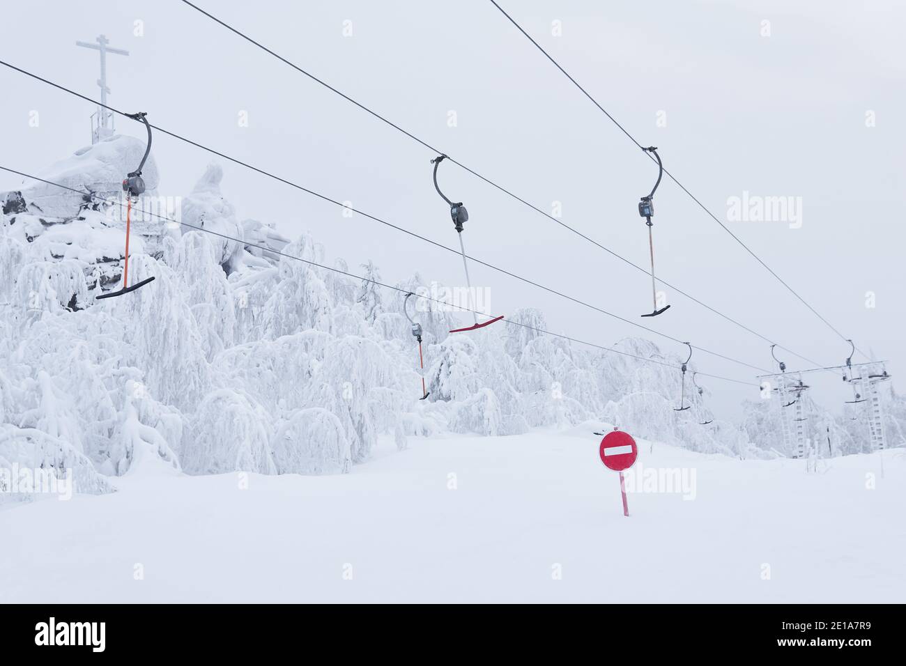 prohibitory road sign No entry against the background of an empty ski T ...