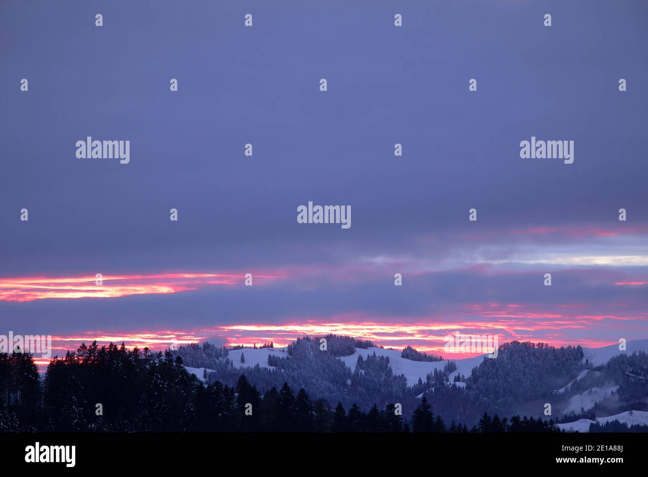 Winter sunset background. Snowy mountains in dusk lights. Swiss alps ...