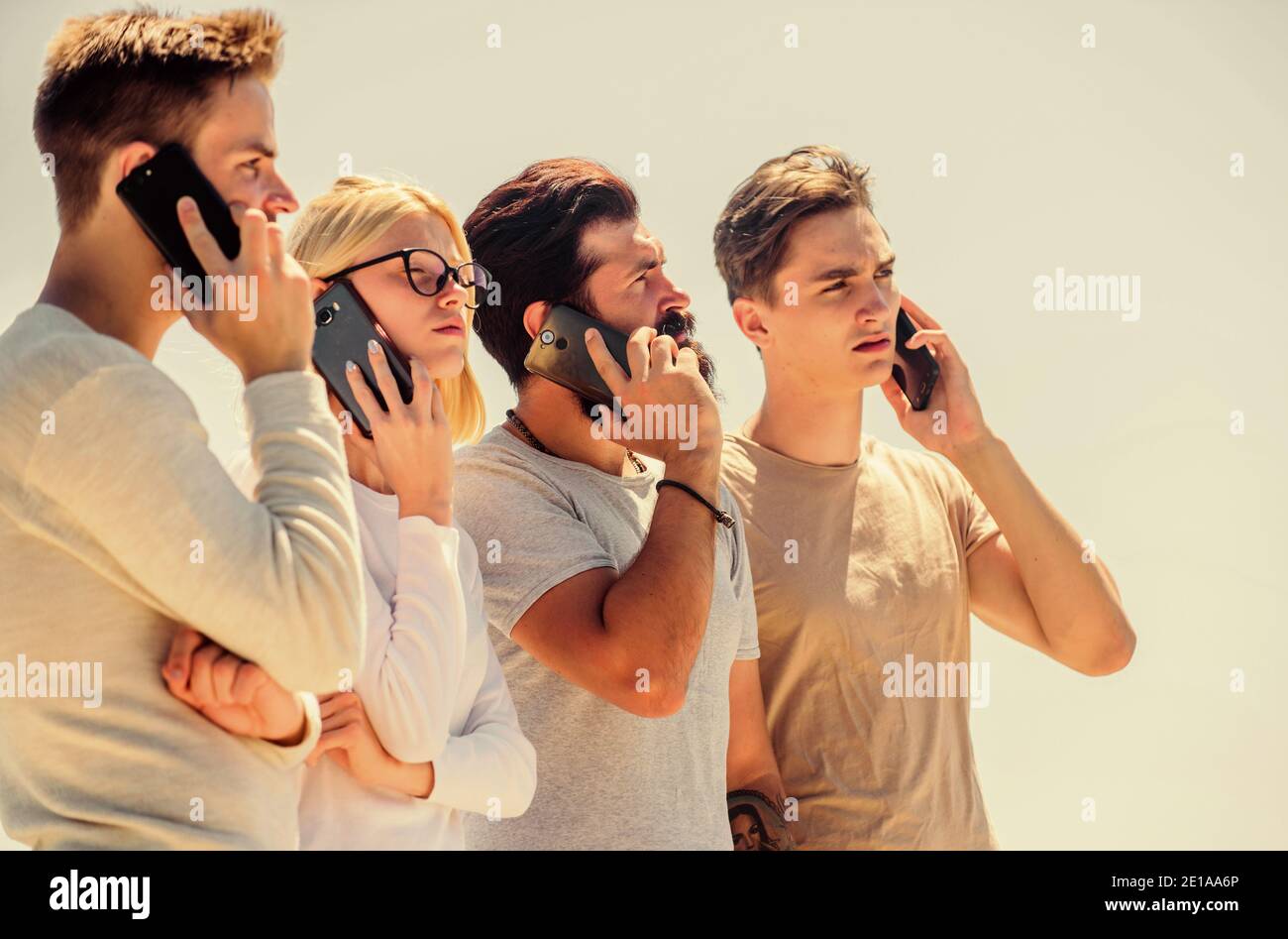 Social media. men and girl speak on phone. group of four people ...