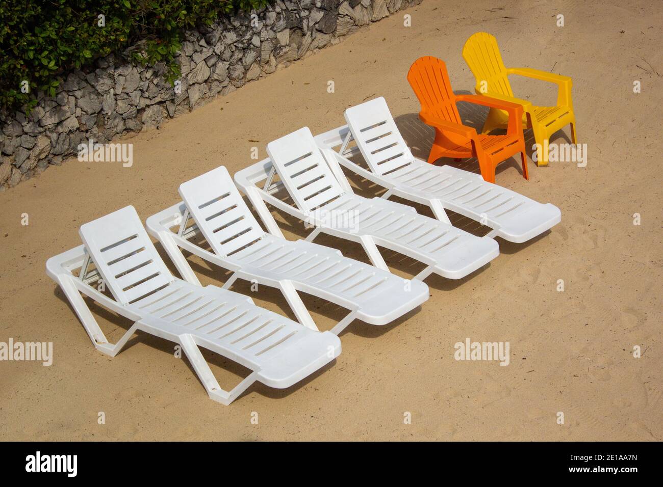 Sunny chairs on a row ready to be used on a peaceful beach Stock Photo ...