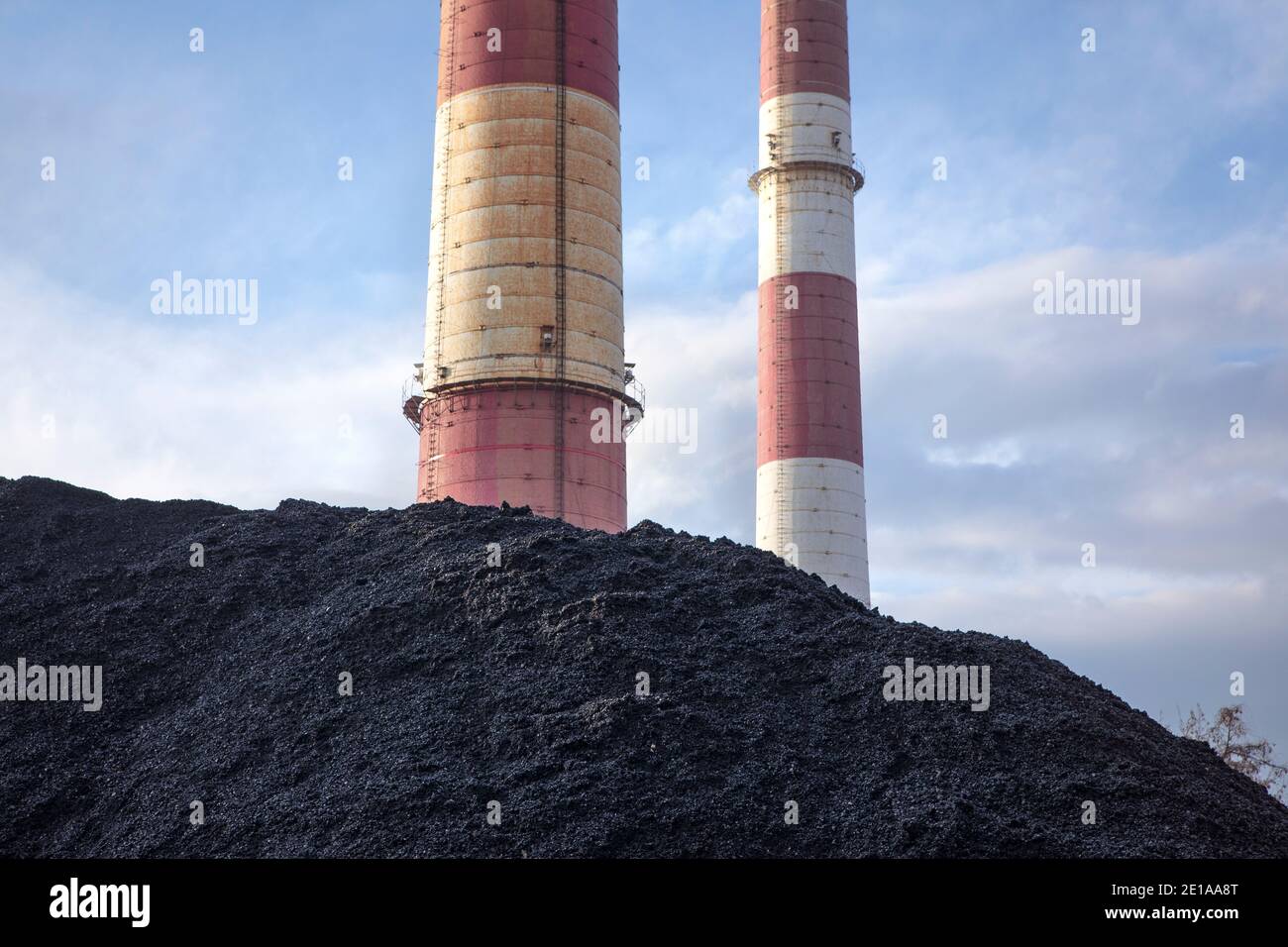 Coal heap, natural black coal with industrial chimney. Industrial ...