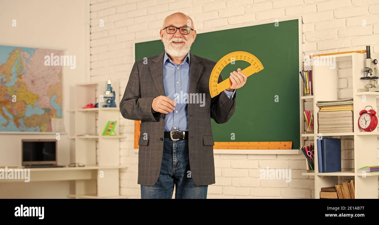 Experienced lecturer. Mature man enjoying job. Teacher going to ...