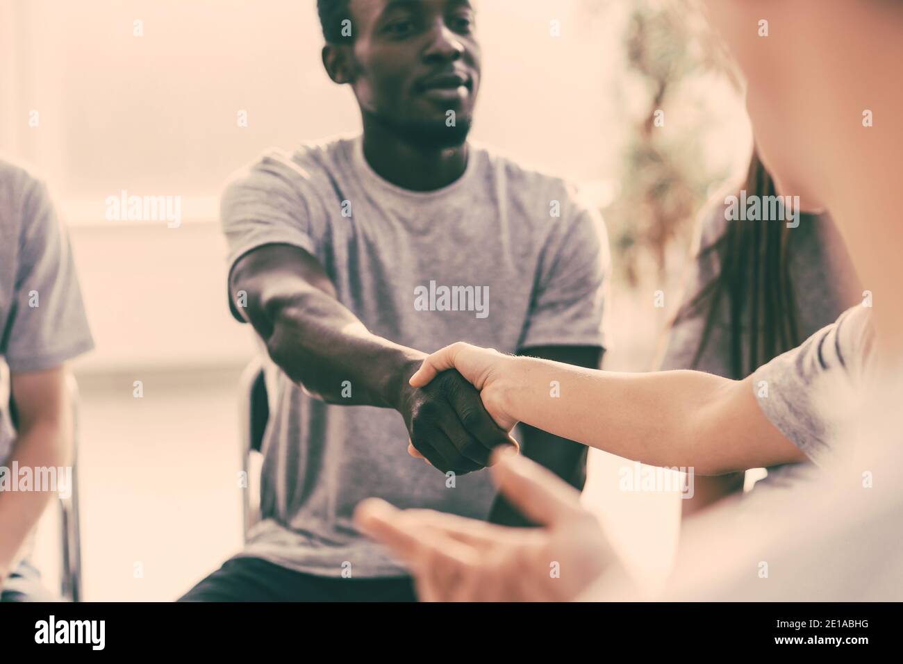 close up. friendly handshake fellow students during the meeting Stock ...