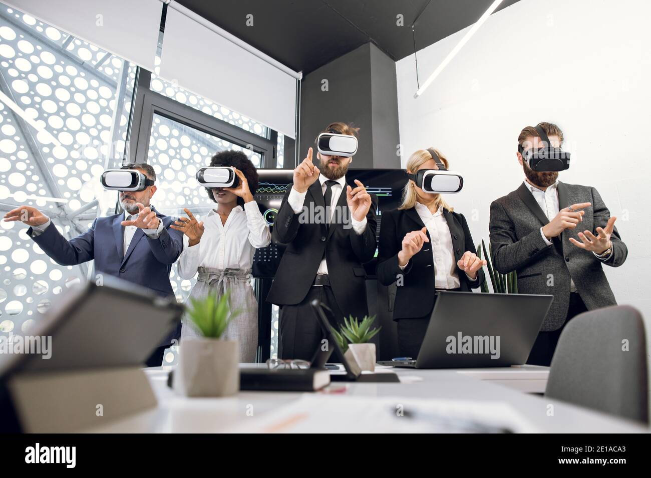 Front view of team of creative multiethnic male and female business ...