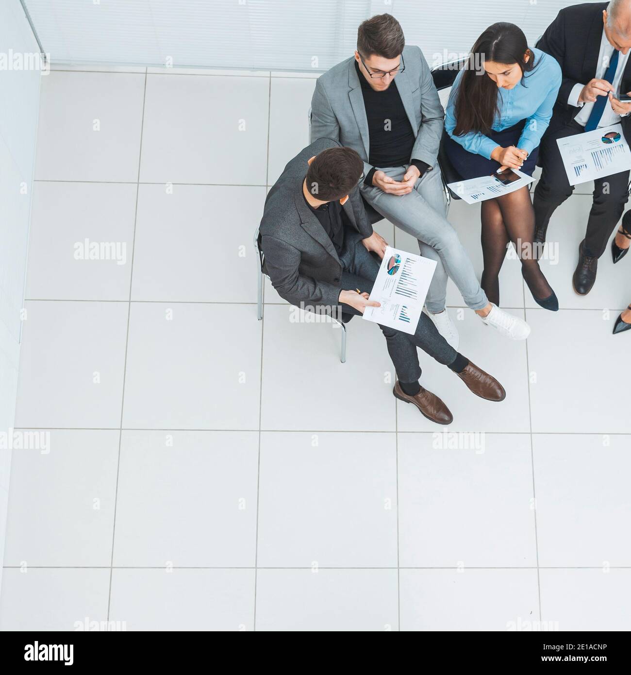 top view. group of employees sitting in a conference room Stock Photo ...