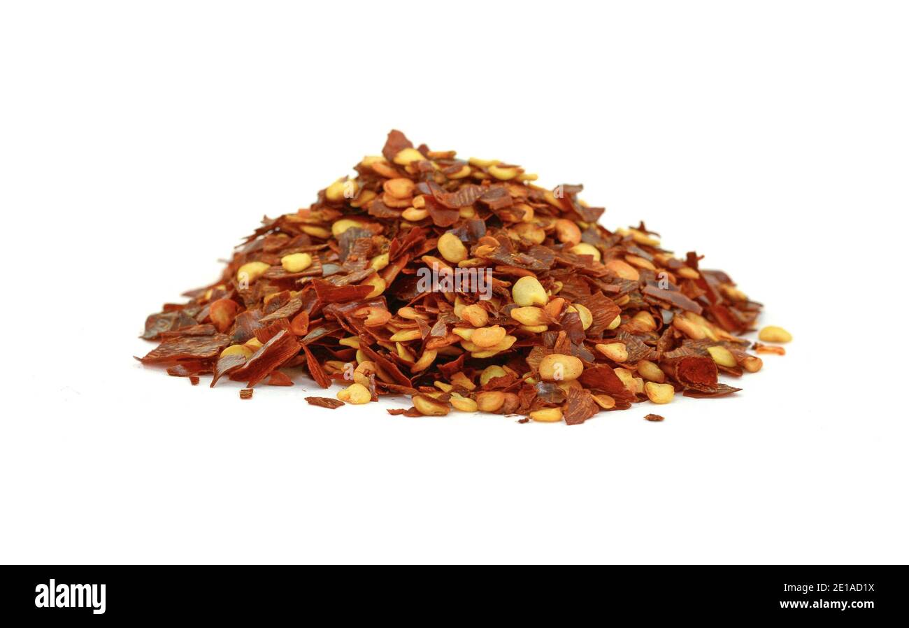 Cayenne pepper. Pile crushed red cayenne pepper, dried chili flakes and ...