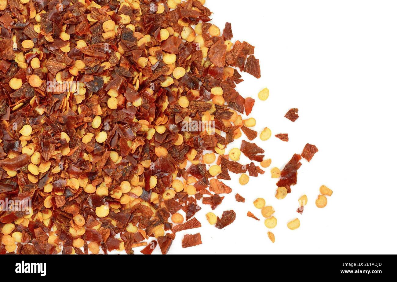 Cayenne pepper. Pile crushed red cayenne pepper, dried chili flakes and ...