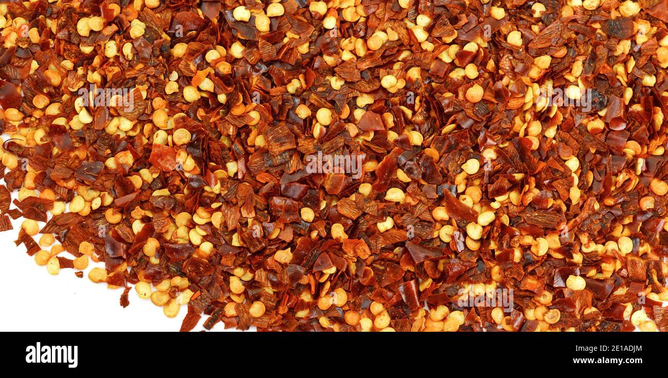 Cayenne pepper. Pile crushed red cayenne pepper, dried chili flakes and ...