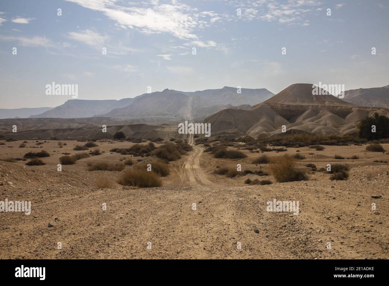 long path across mountains in the middle of the desert Stock Photo - Alamy