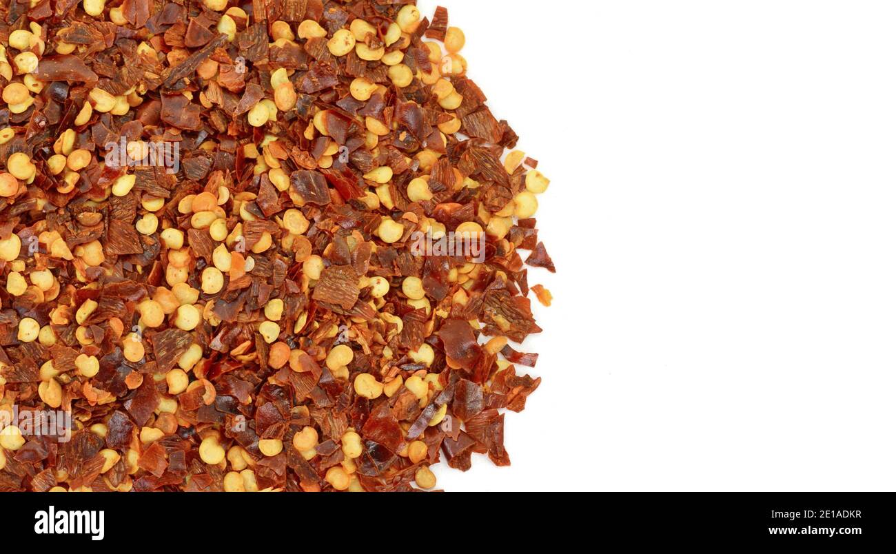 Cayenne pepper. Pile crushed red cayenne pepper, dried chili flakes and ...