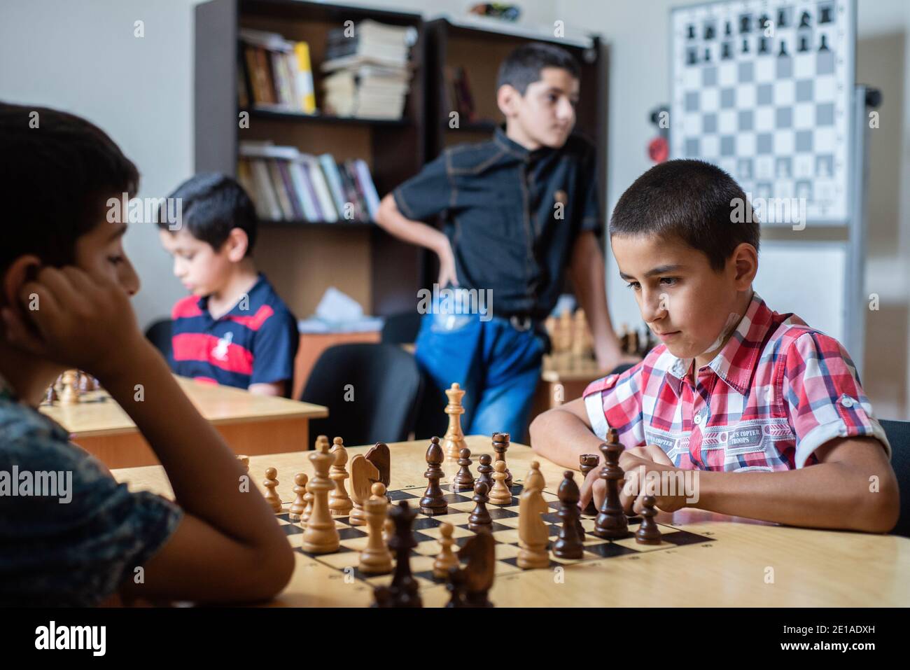 Learners of the Quba Chess School play chess during a training lesson ...