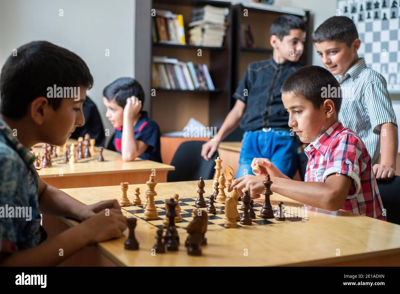 Learners of the Quba Chess School play chess during a training lesson ...
