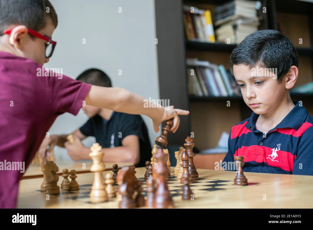 Children playing chess in classroom hi-res stock photography and images ...