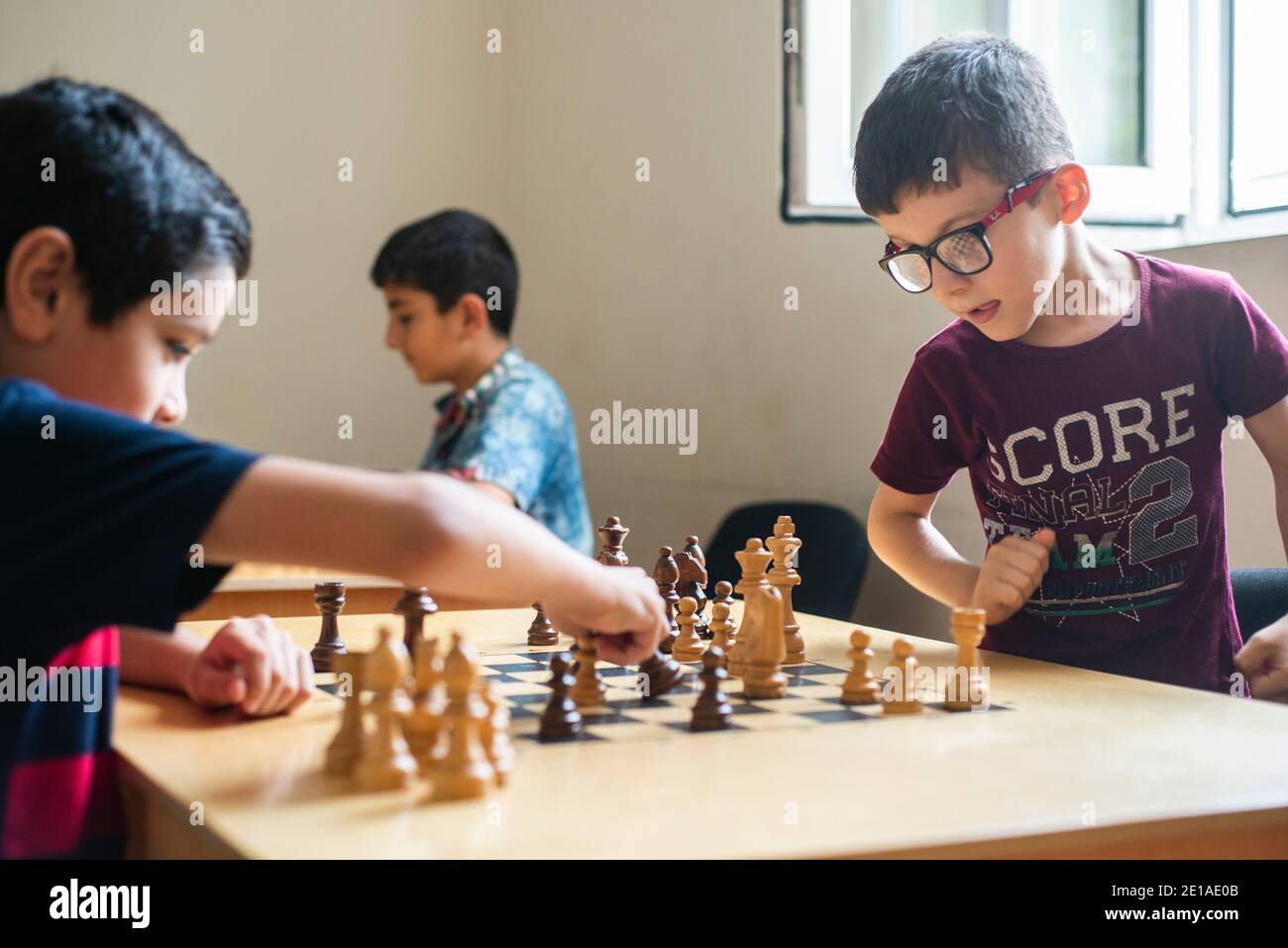 Learners of the Quba Chess School play chess during a training lesson ...