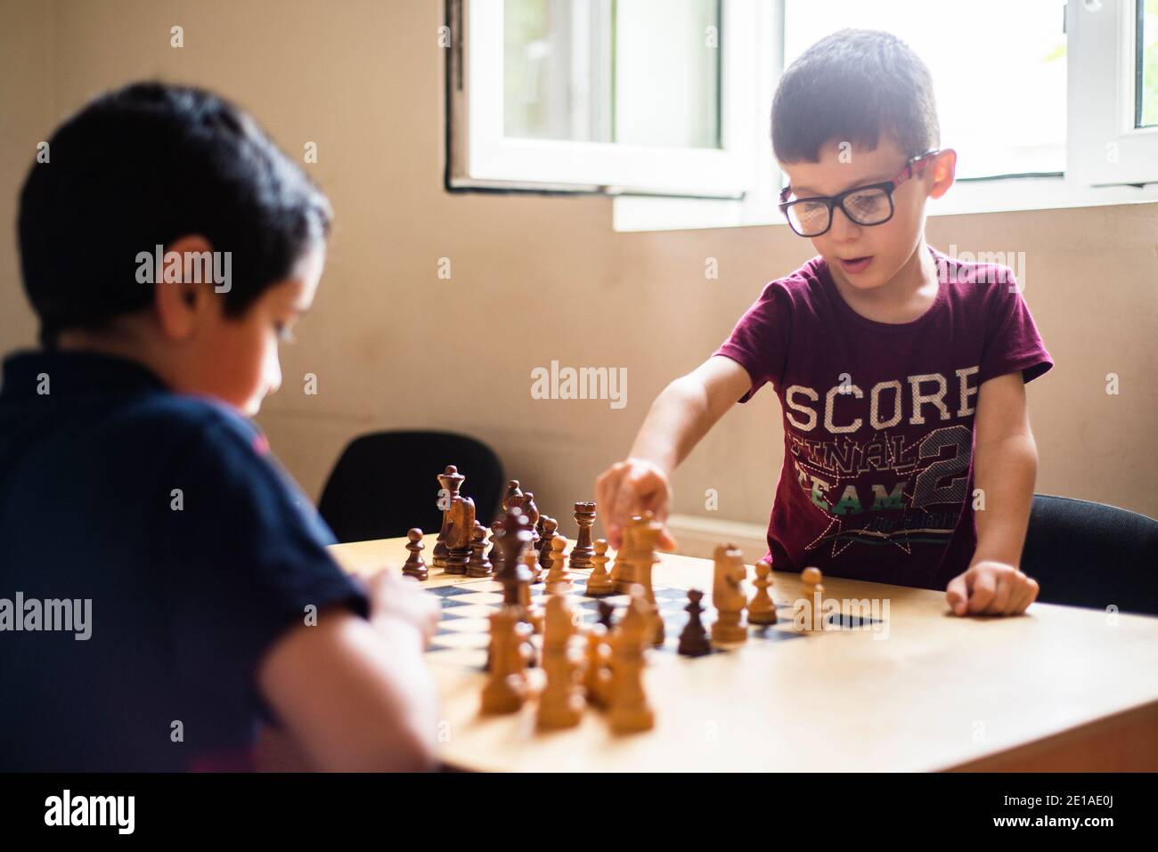 Learners of the Quba Chess School play chess during a training lesson ...