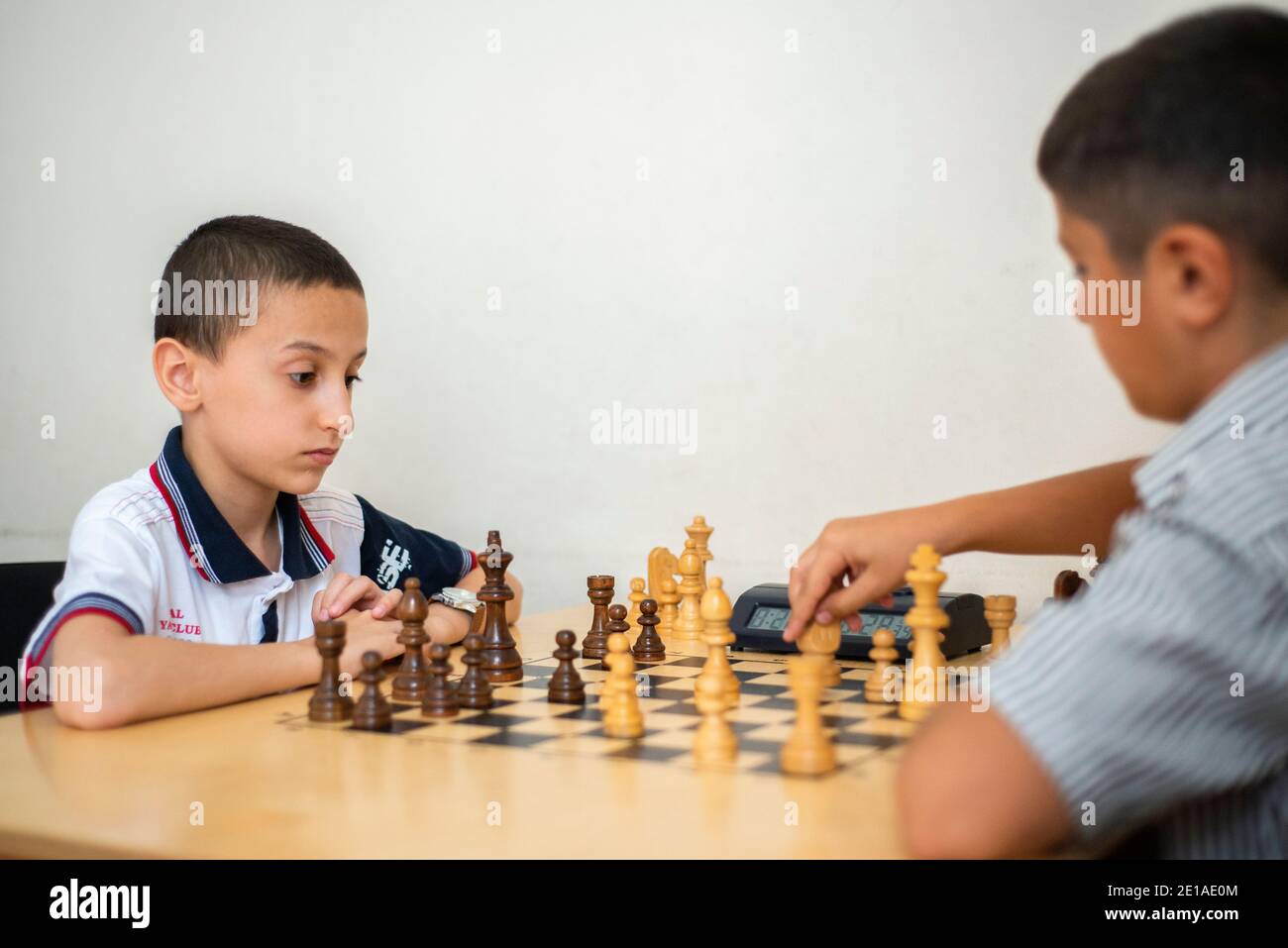 Children playing chess in classroom hi-res stock photography and images ...