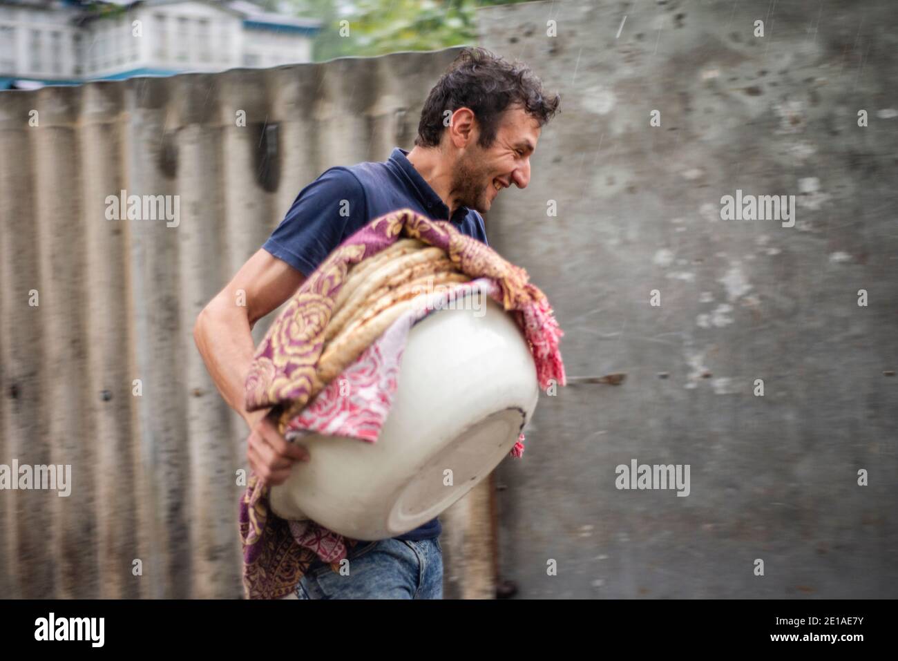 A man carries freshly baked traditional Lezgi bread in Khazra village ...