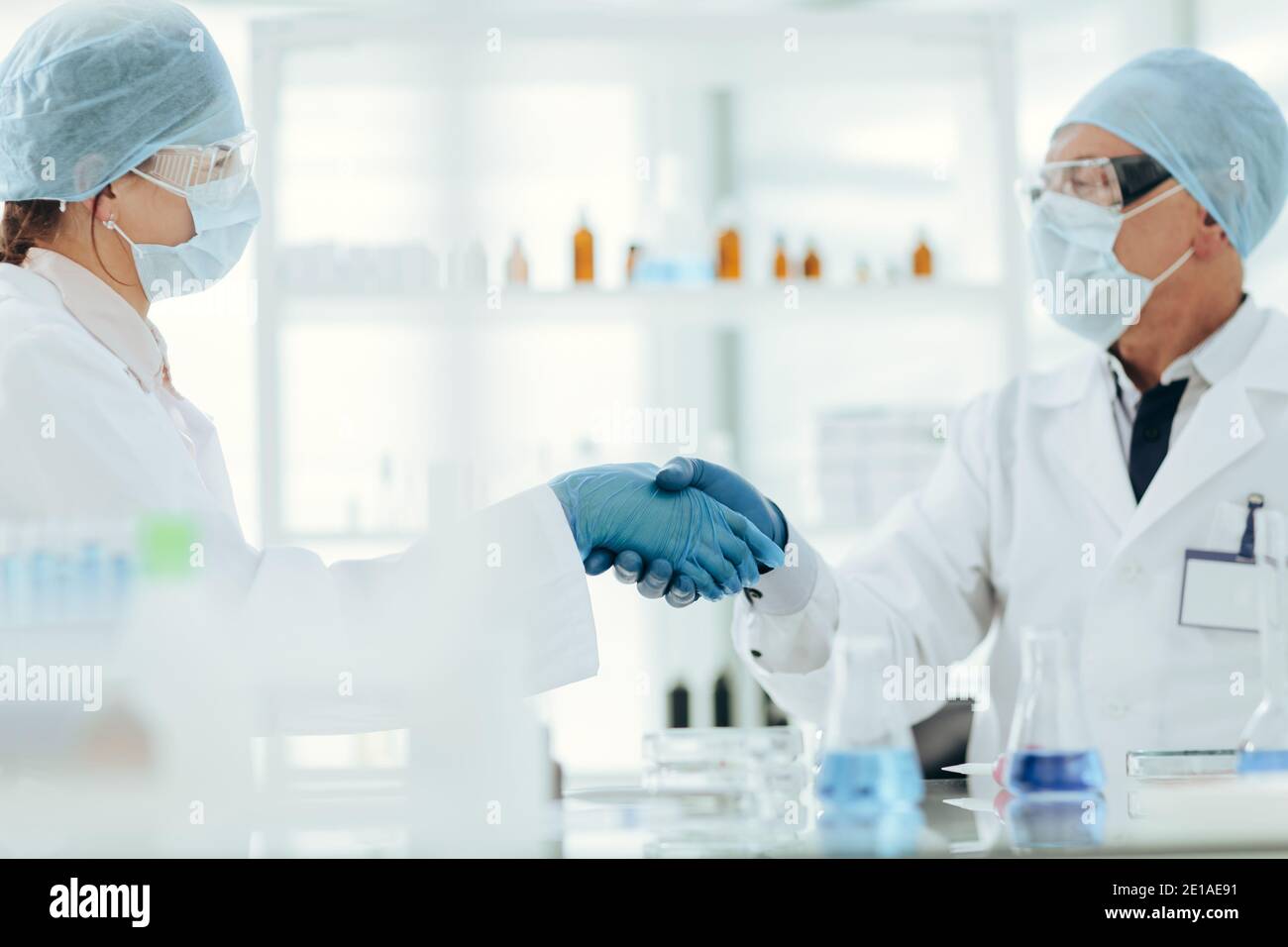 close up. scientists colleagues shaking hands with each other Stock ...