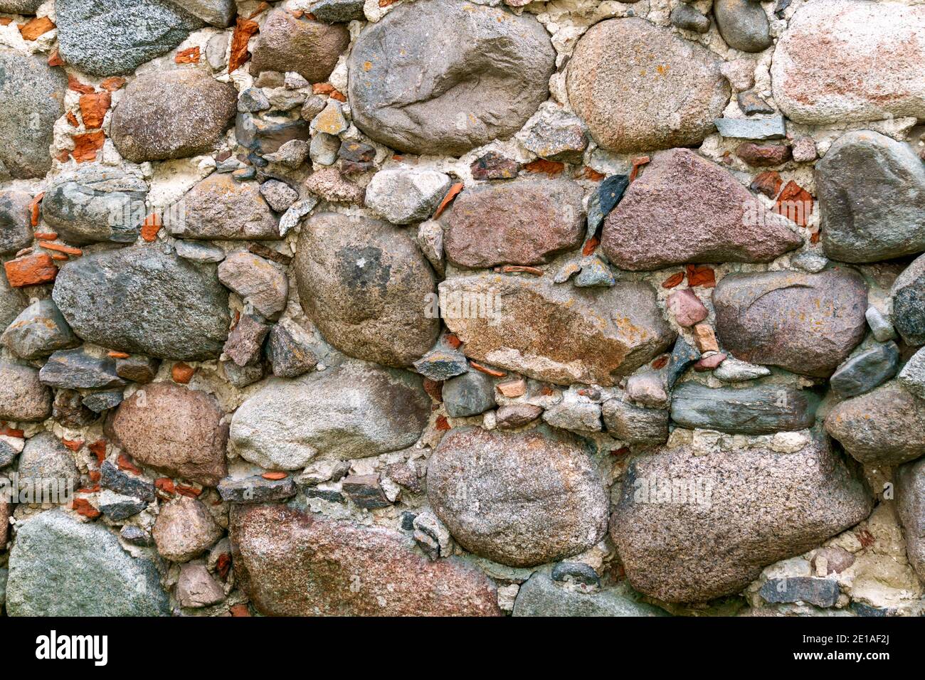 Old masonry wall of large granite cobblestones Stock Photo - Alamy