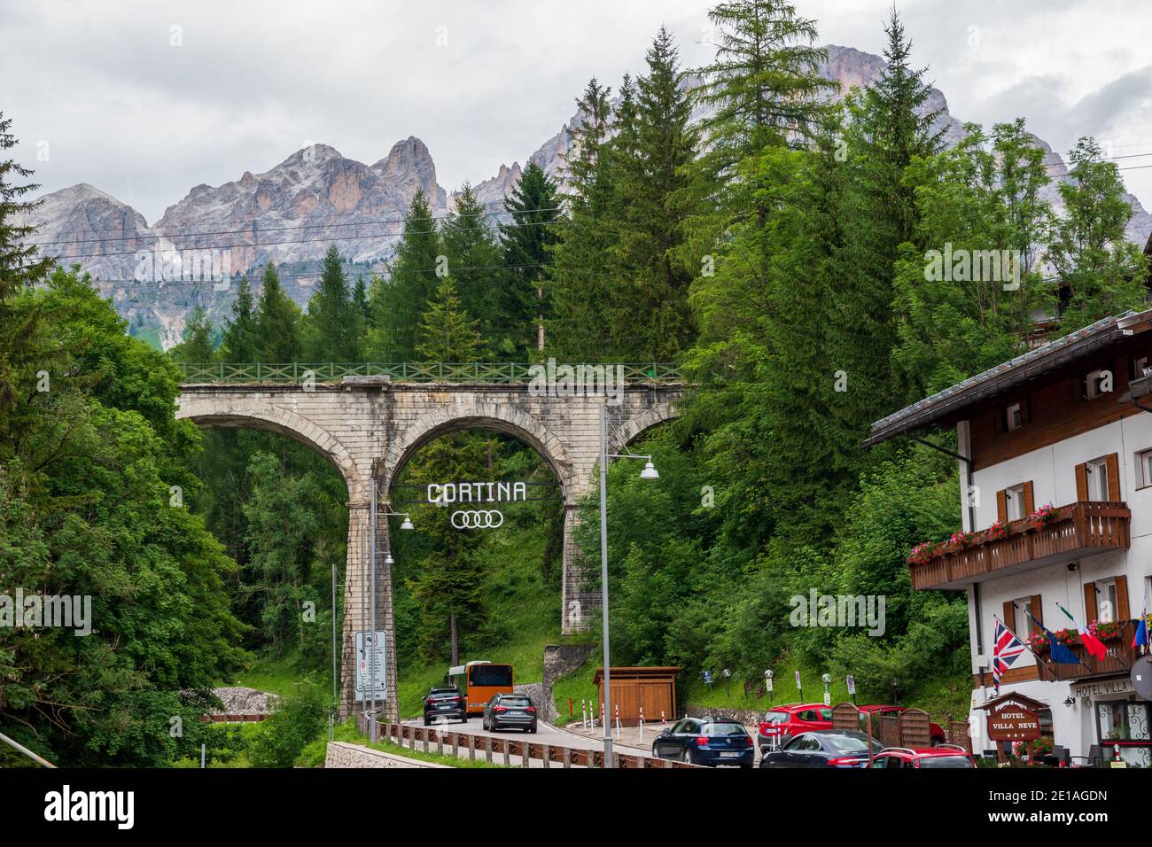 The rings from the Olympic games under the bridge from the town Cortina ...