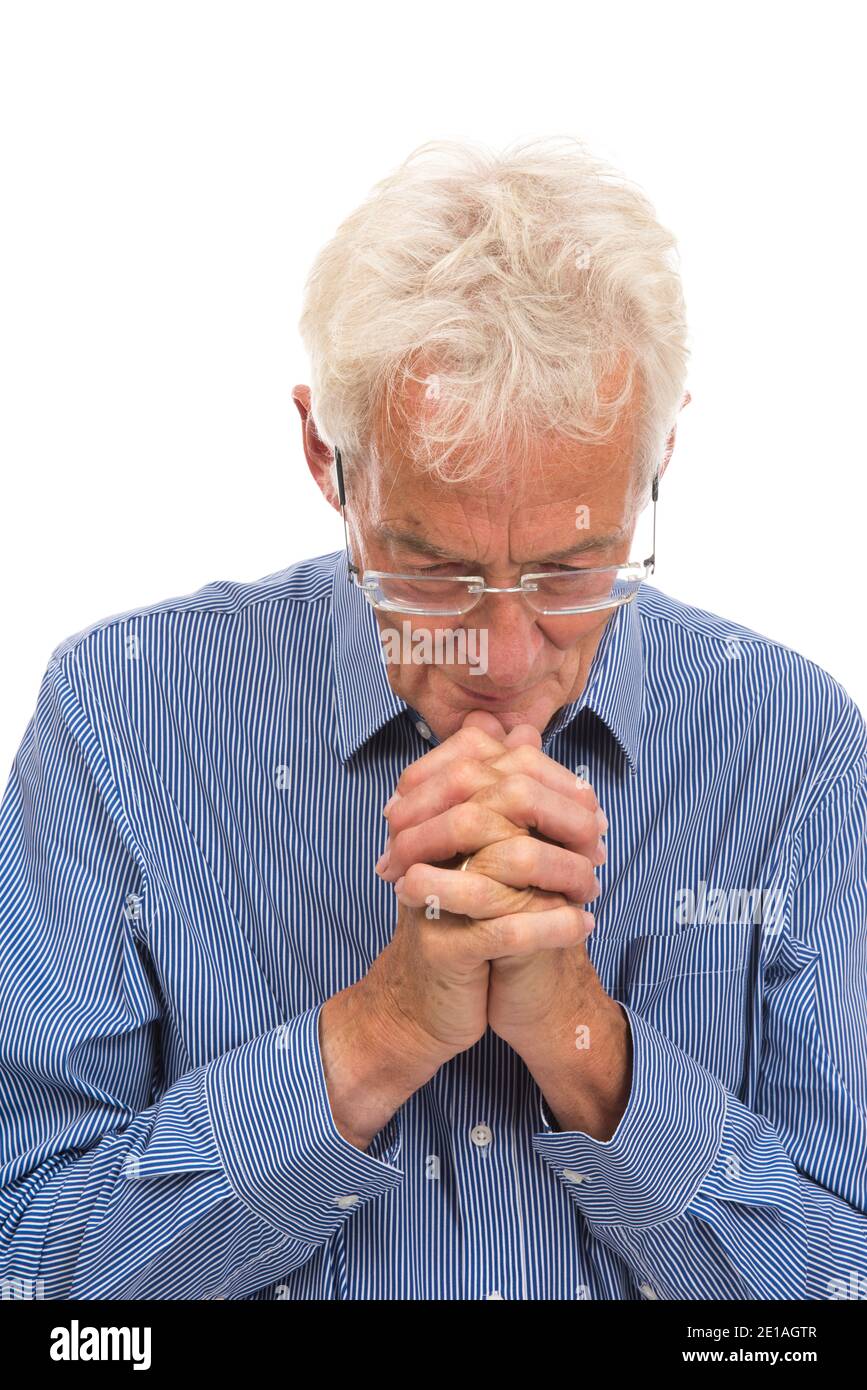 Portrait praying senior man isolated against white background Stock ...