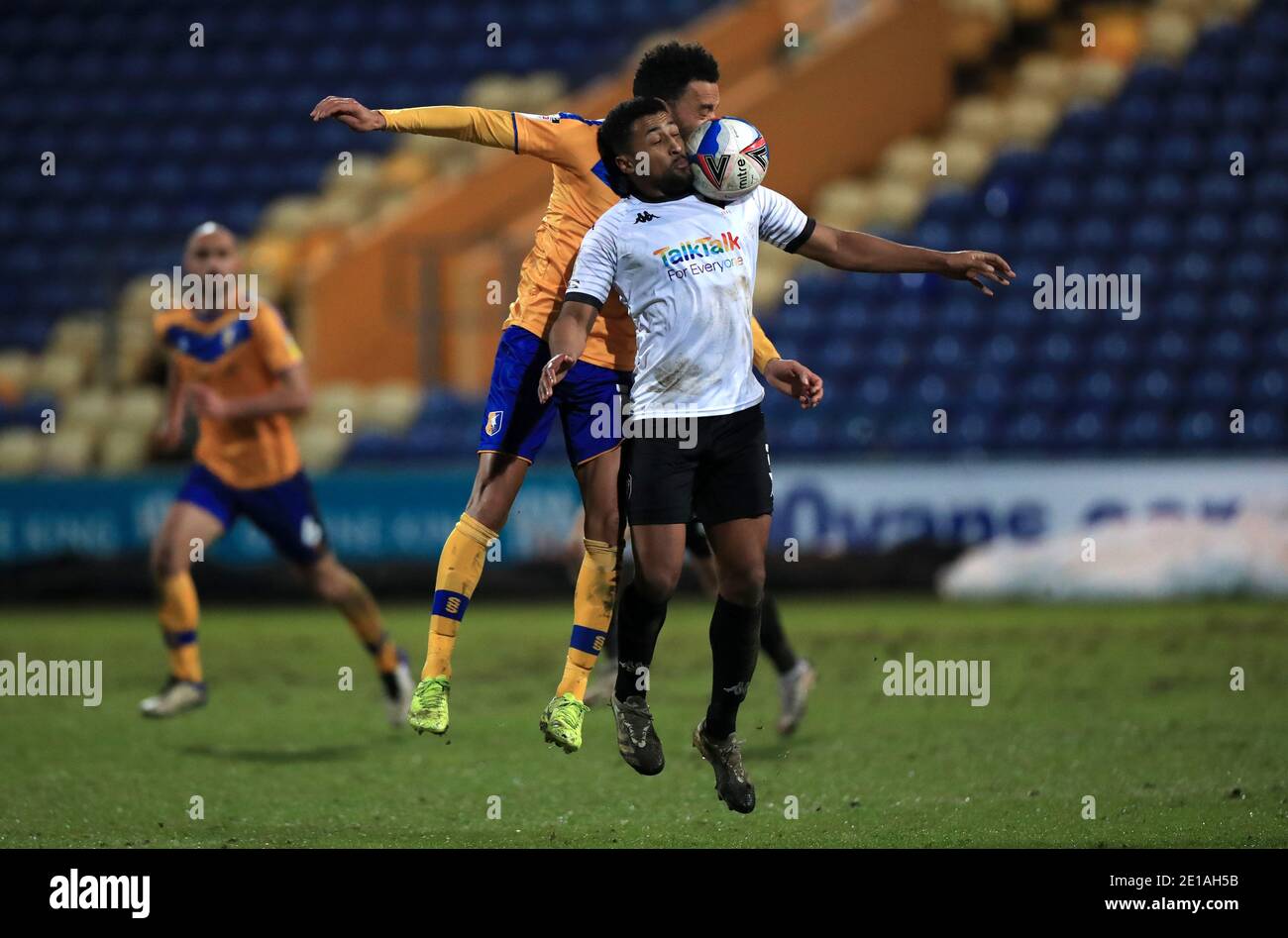 Mansfield Town's James Perch (left) and Salford City's Ibou Touray ...