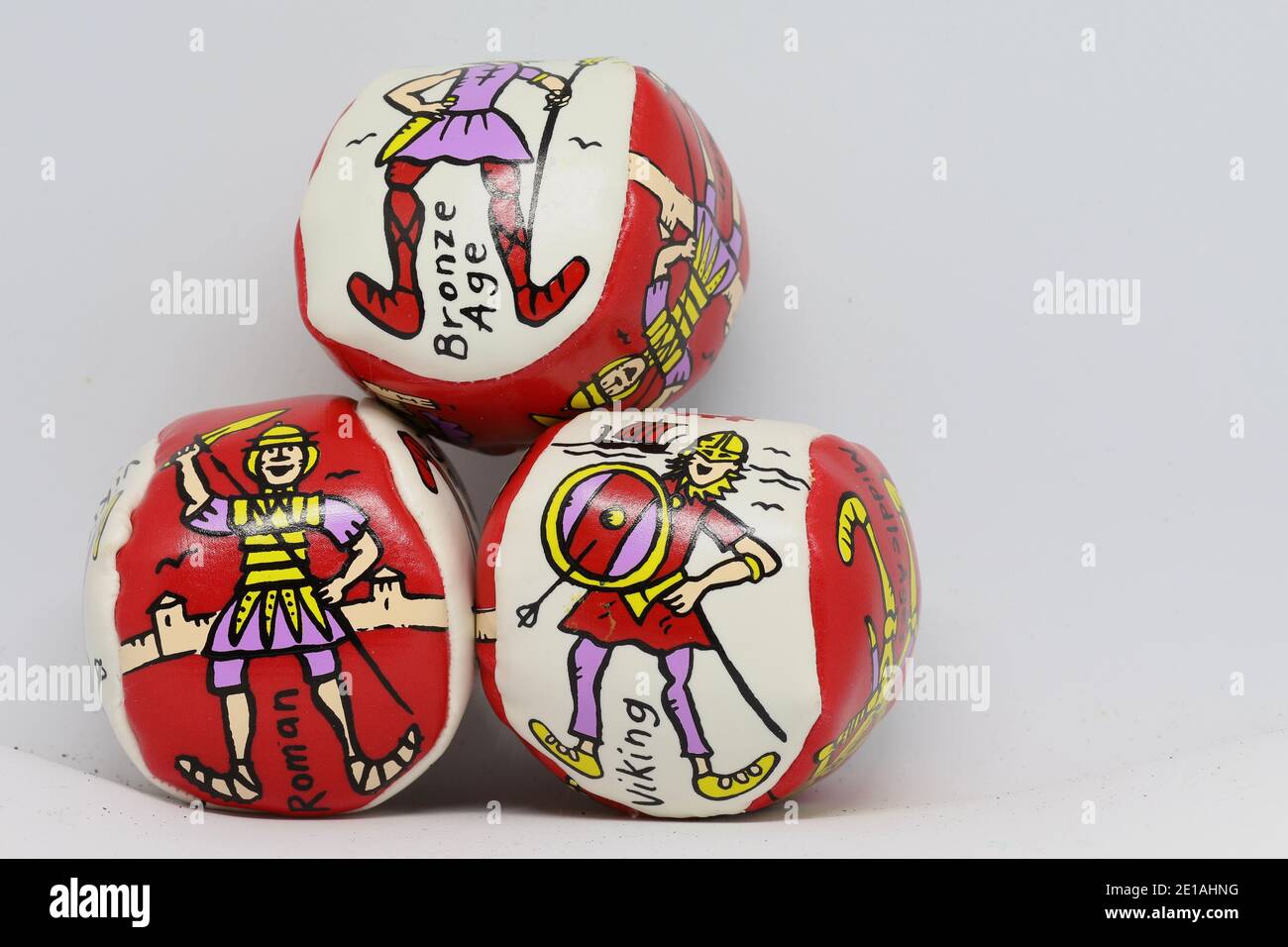 Three juggling balls decorated with pictures of roman, viking and ...