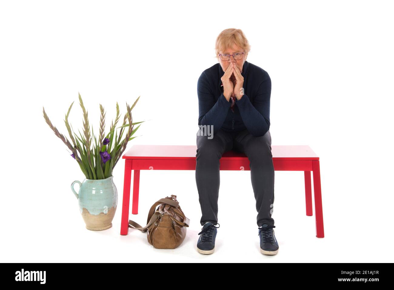 Sad senior woman is waiting isolated over white background Stock Photo ...