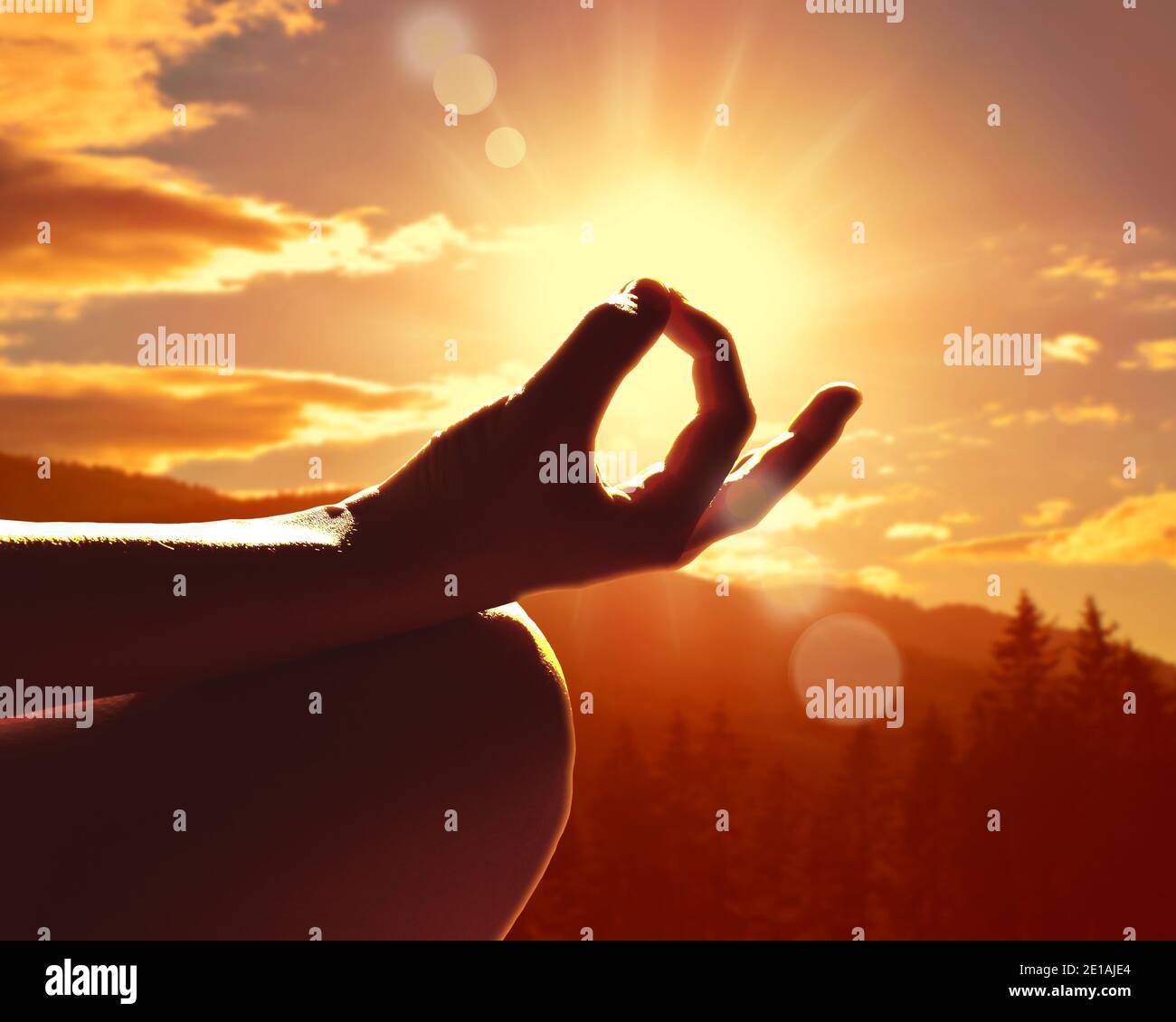 Close up of a hand in a meditation pose. Sunset in the mountains Stock ...
