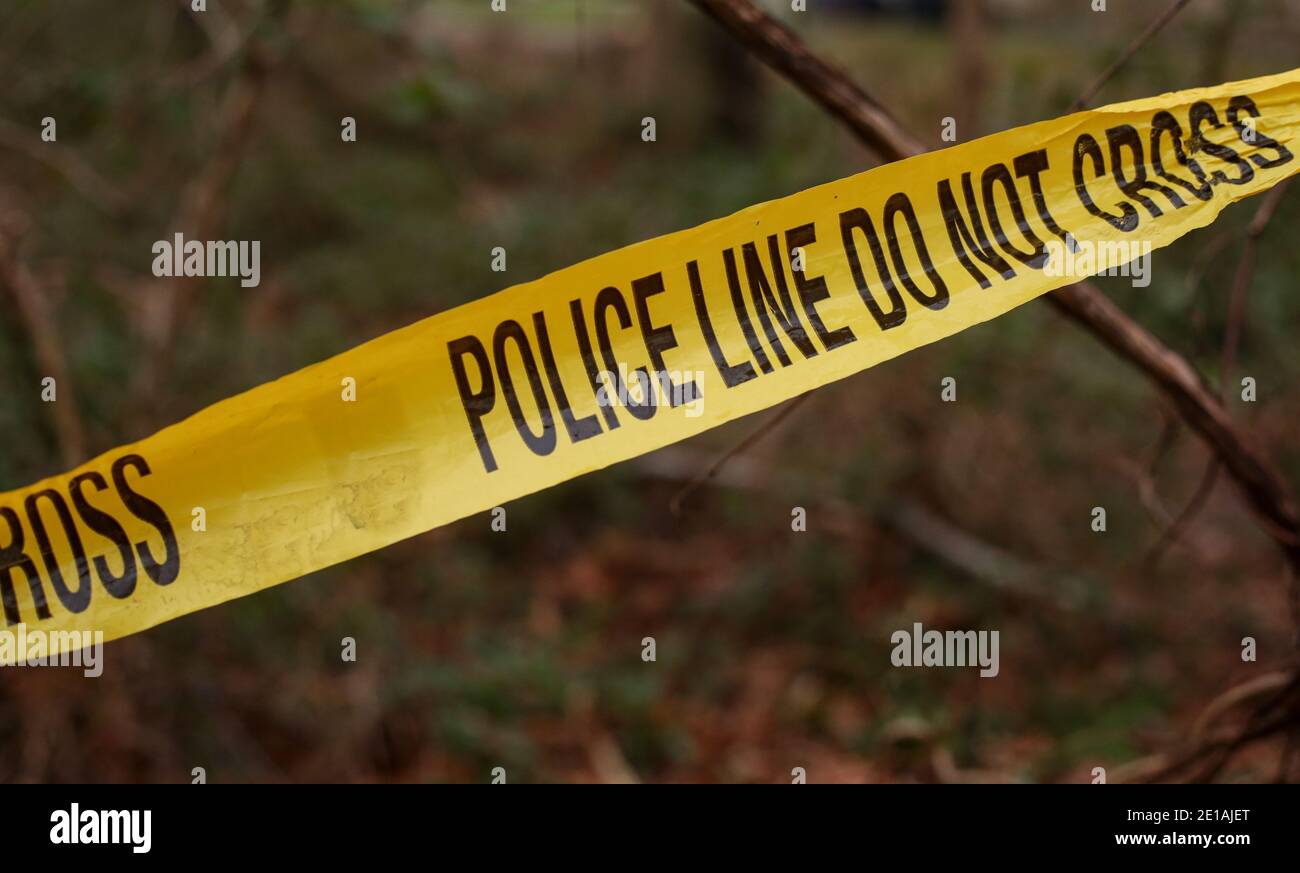 Police line , caution do not enter area Stock Photo - Alamy