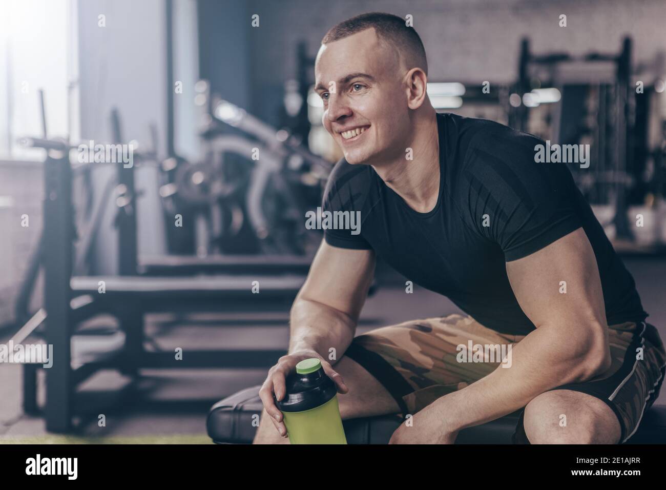 Muscular young bodybuilder in relaxed hi-res stock photography and ...