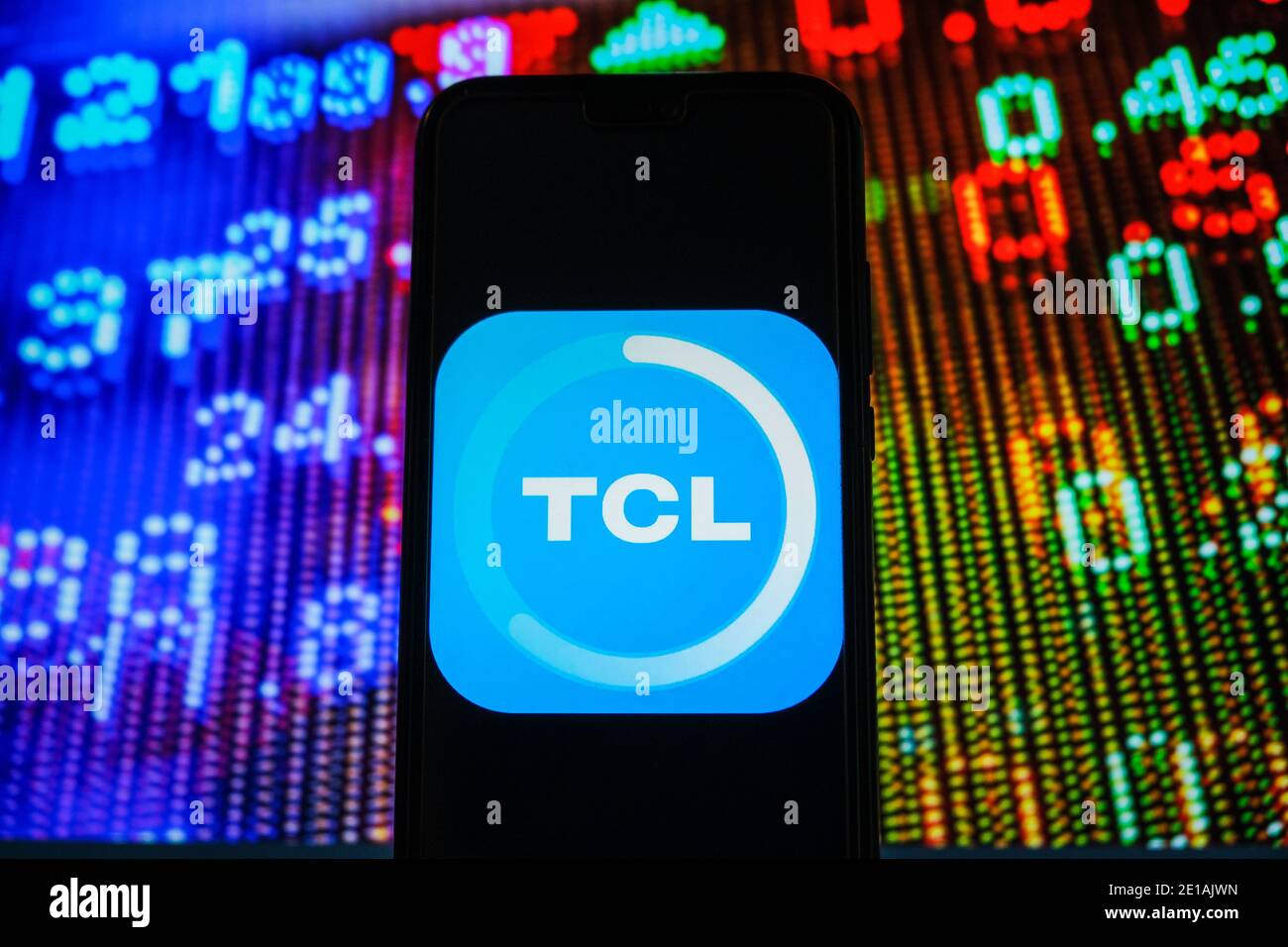 In this photo illustration, a TCL logo seen displayed on a smartphone ...