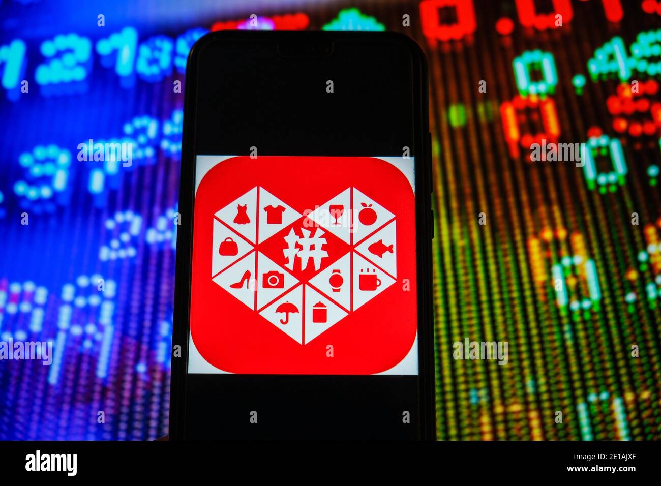 In this photo illustration, a Pinduoduo logo seen displayed on a ...