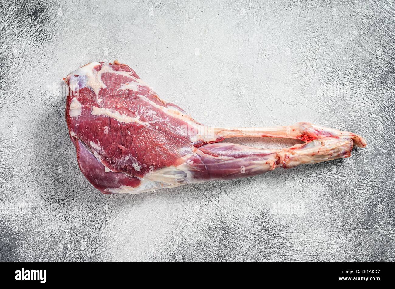Raw lamb leg. Fresh organic meat. White background. Top view Stock ...