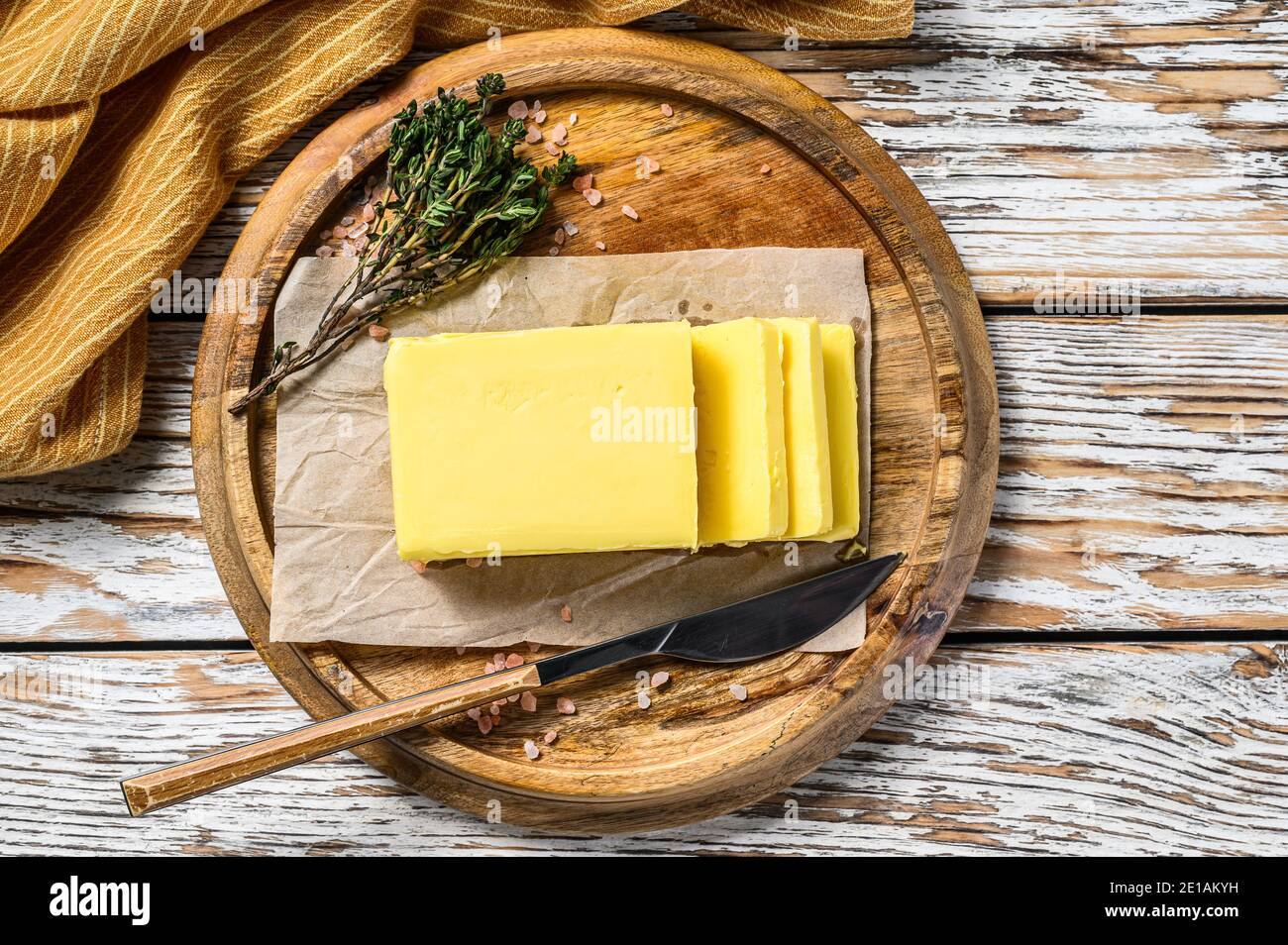 Block of fresh Butter, dairy farm products. White wooden background.Top ...