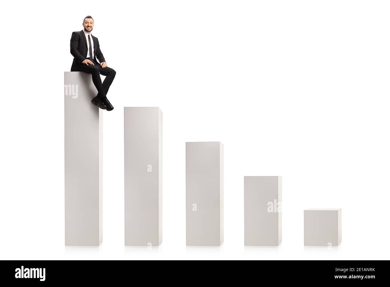 Businessman sitting on the highest column in a chart isolated on white ...