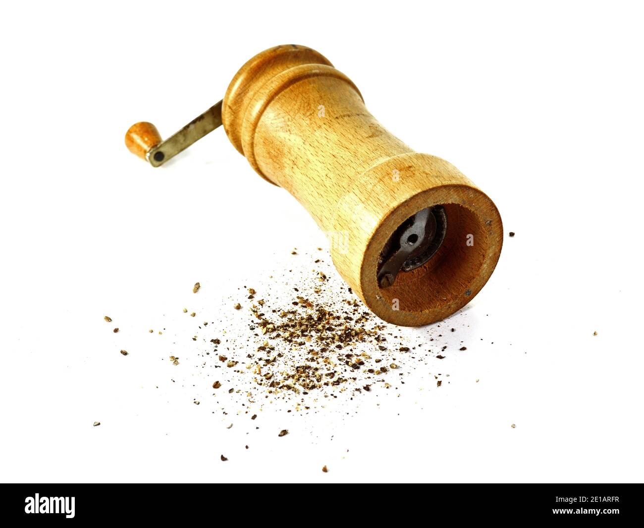 Pepper mill on a white isolated background with peppers Stock Photo - Alamy