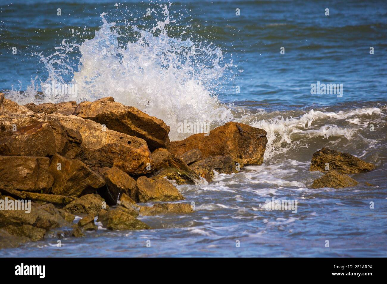 Still motion of the impact of a sea wave splashing and spreading with ...