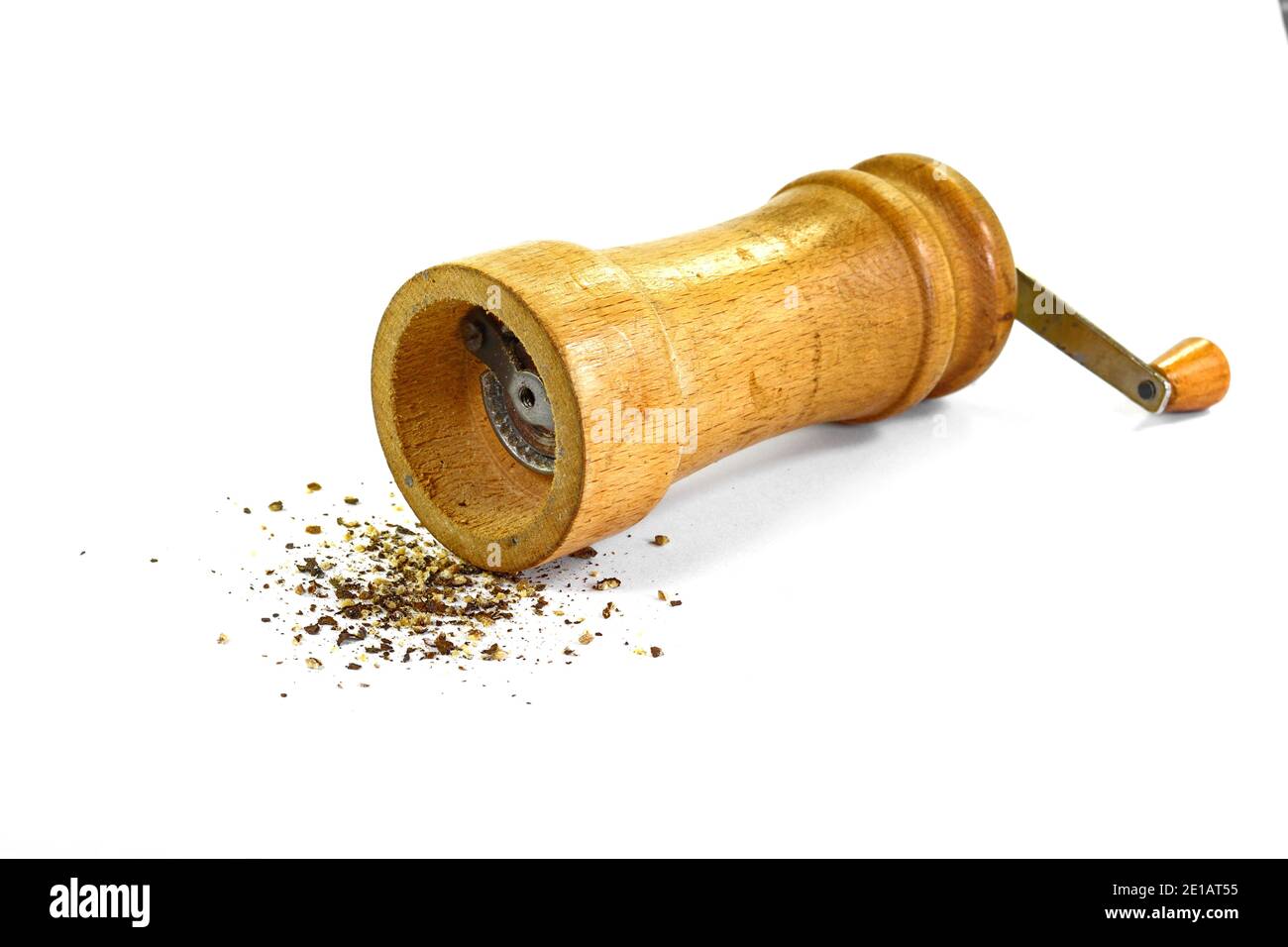 Pepper mill on a white isolated background with peppers Stock Photo - Alamy