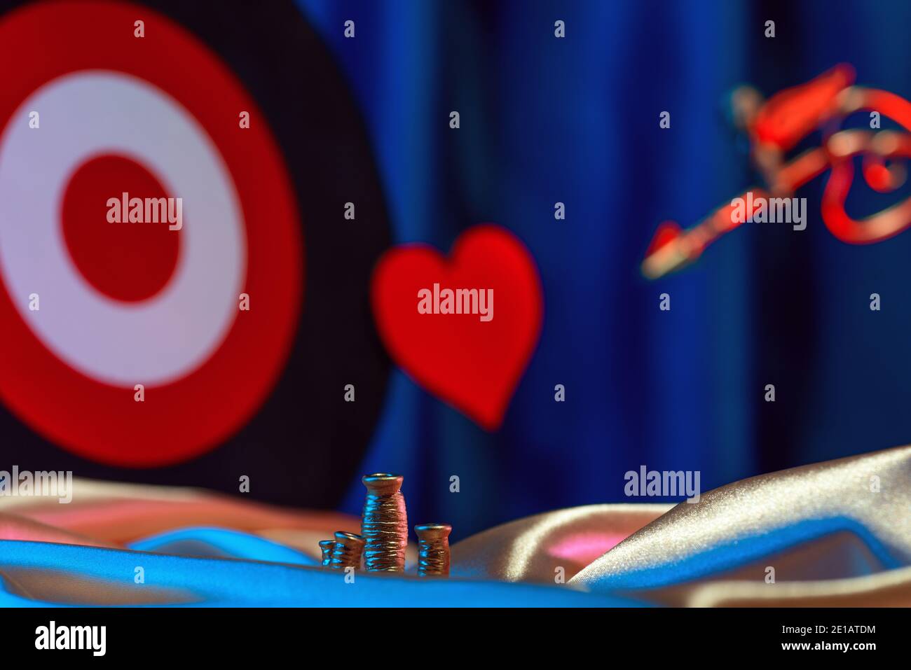 Small golden cupid marks his target with an arrow at the heart ...