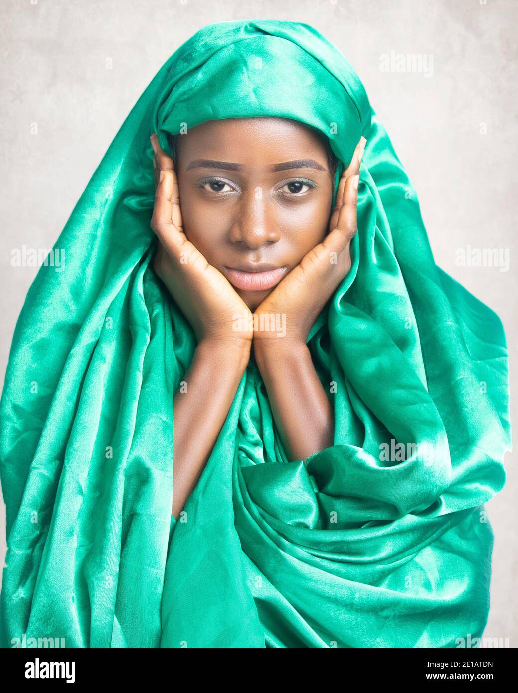 Brown skin lady with a green attire in a portrait picture Stock Photo ...