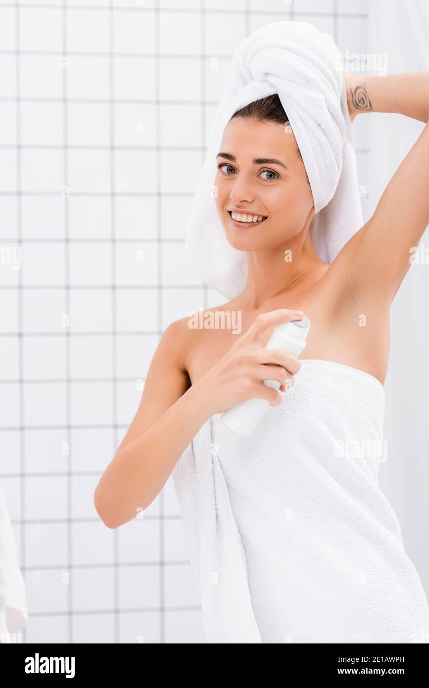 Woman using body spray in hi-res stock photography and images - Alamy