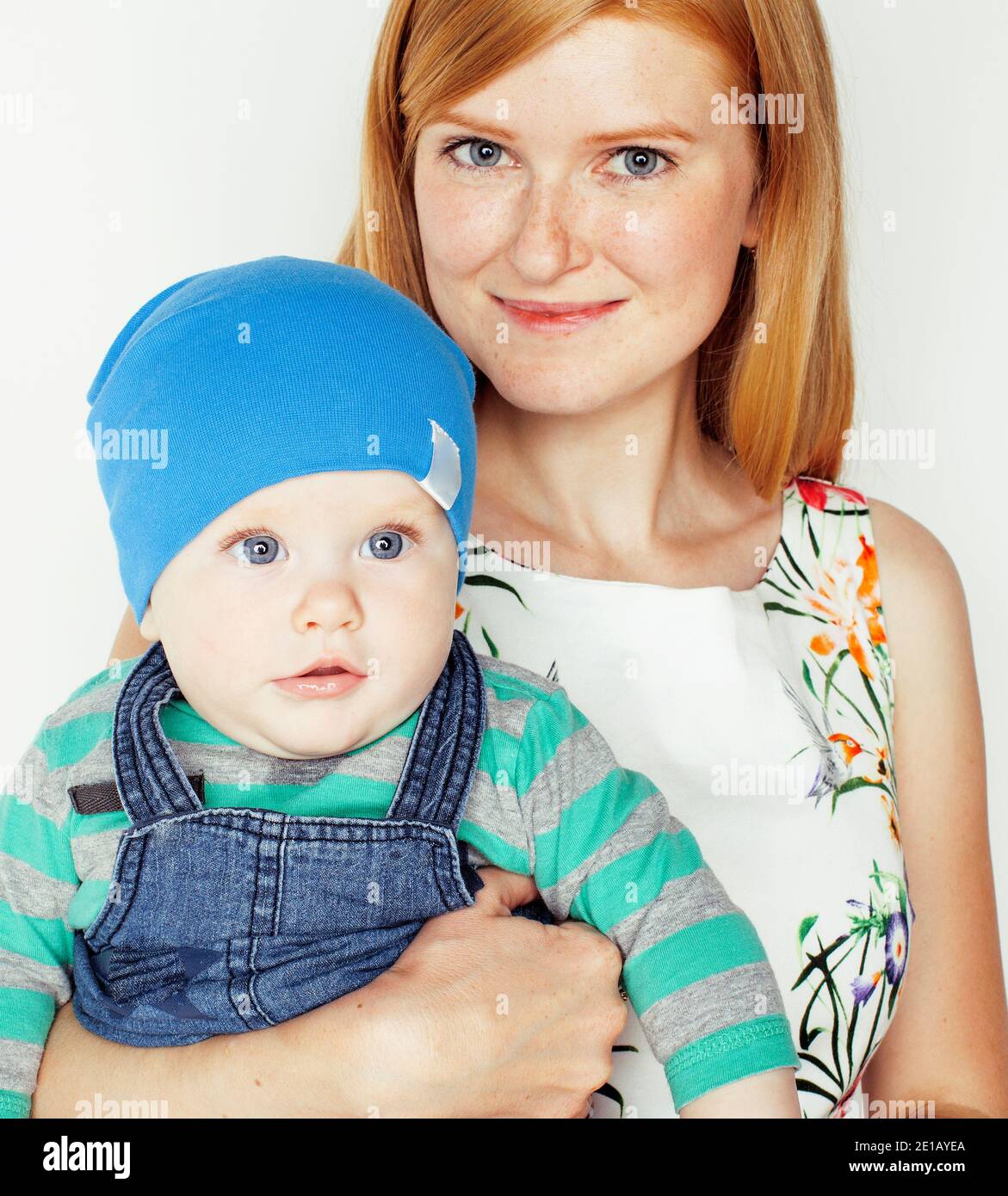 young beauty mother with cute baby, red head happy modern family ...