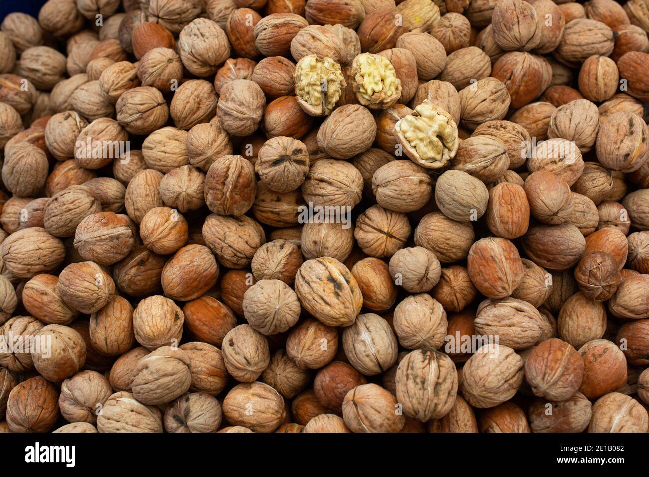 Whole walnuts background. Healthy organic food concept Stock Photo - Alamy
