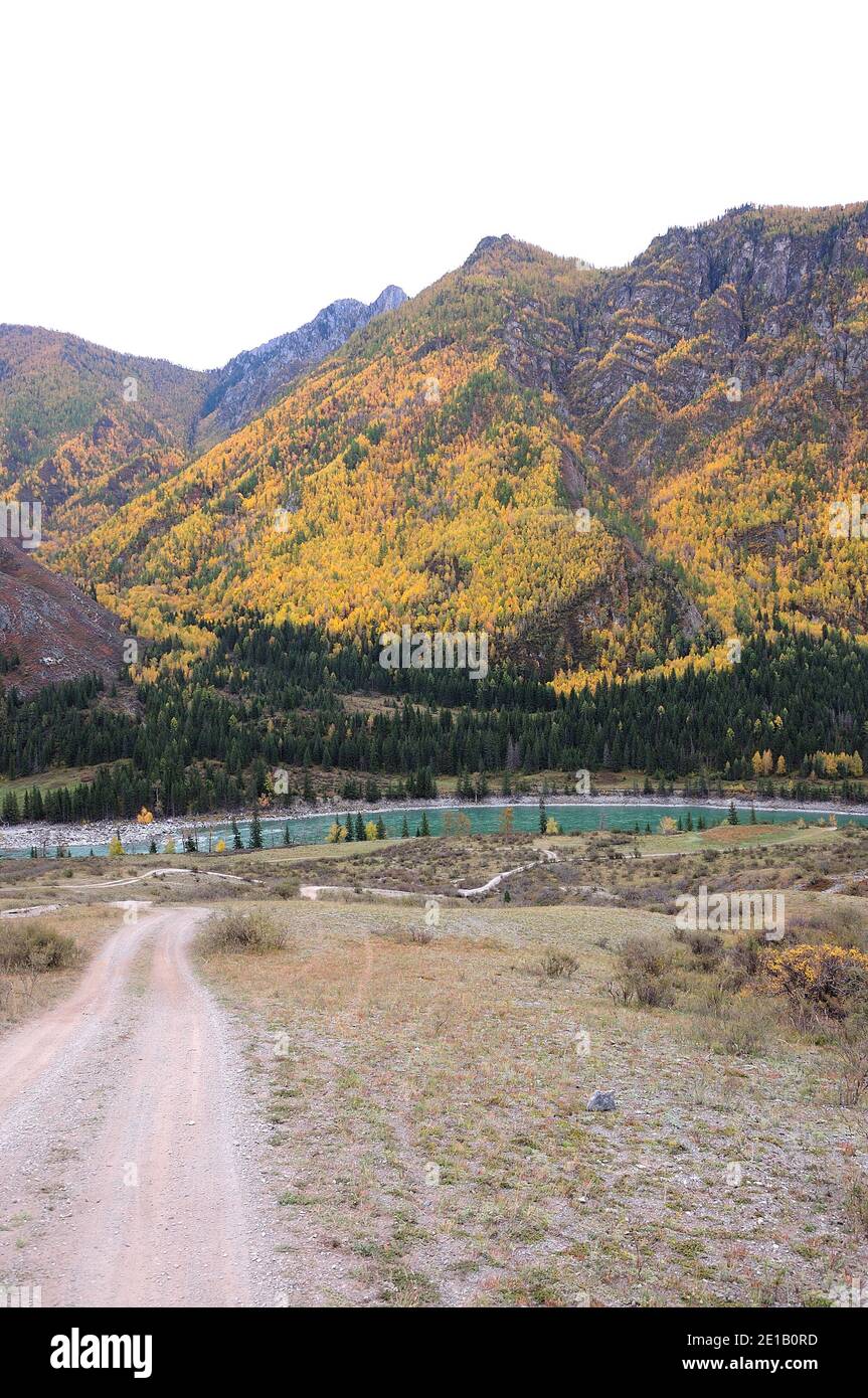 A field road going along the slope to the bend of the river at the foot ...