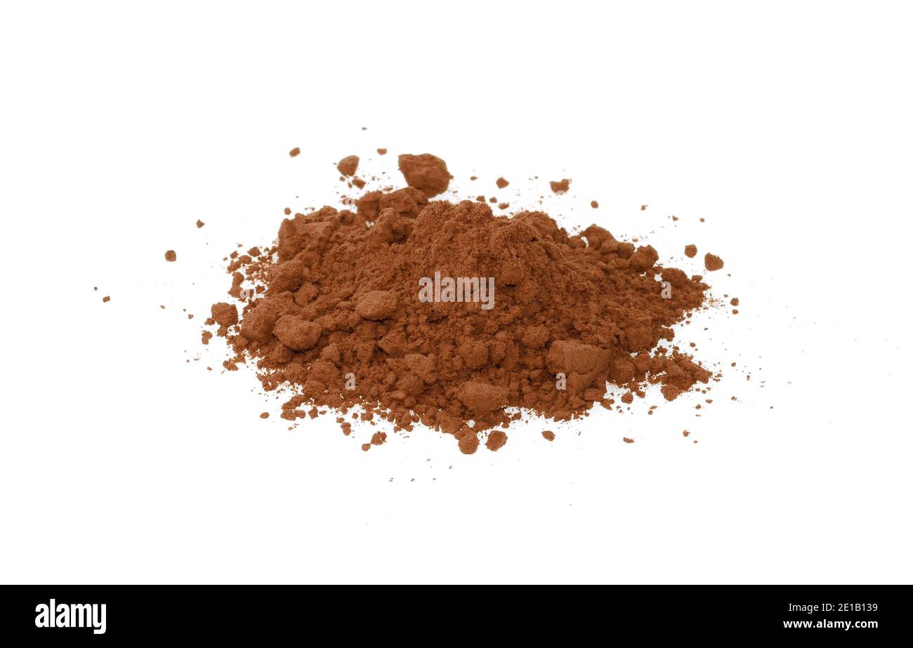 Pile cocoa powder isolated on white background Stock Photo - Alamy