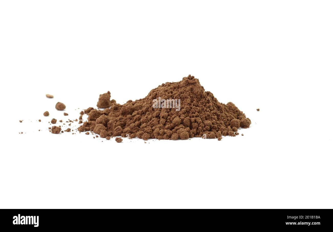 Pile cocoa powder isolated on white background Stock Photo - Alamy